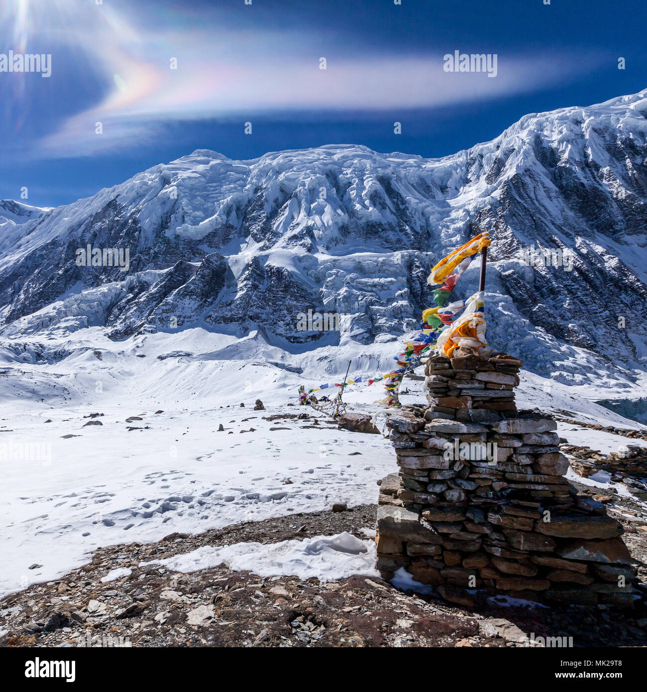 Rainbow cloud above Himalaya mountains near Tilicho lake. Nepal, Annapurna Conservation Area ...