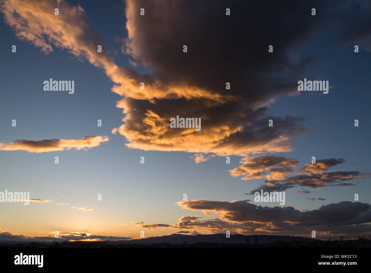 Golden hour sky with beautiful clouds Stock Photo - Alamy