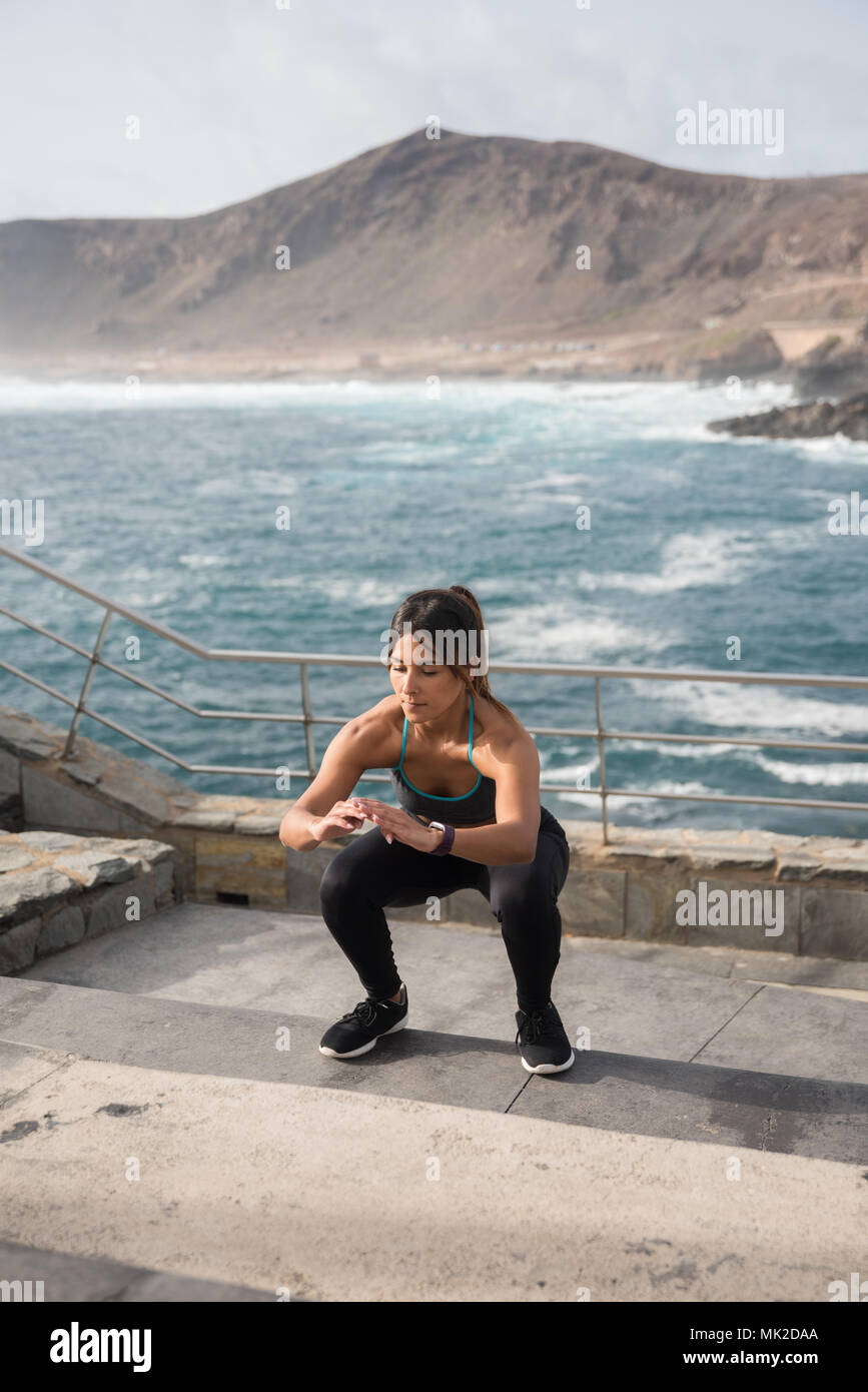 Crouching lady hi-res stock photography and images - Alamy