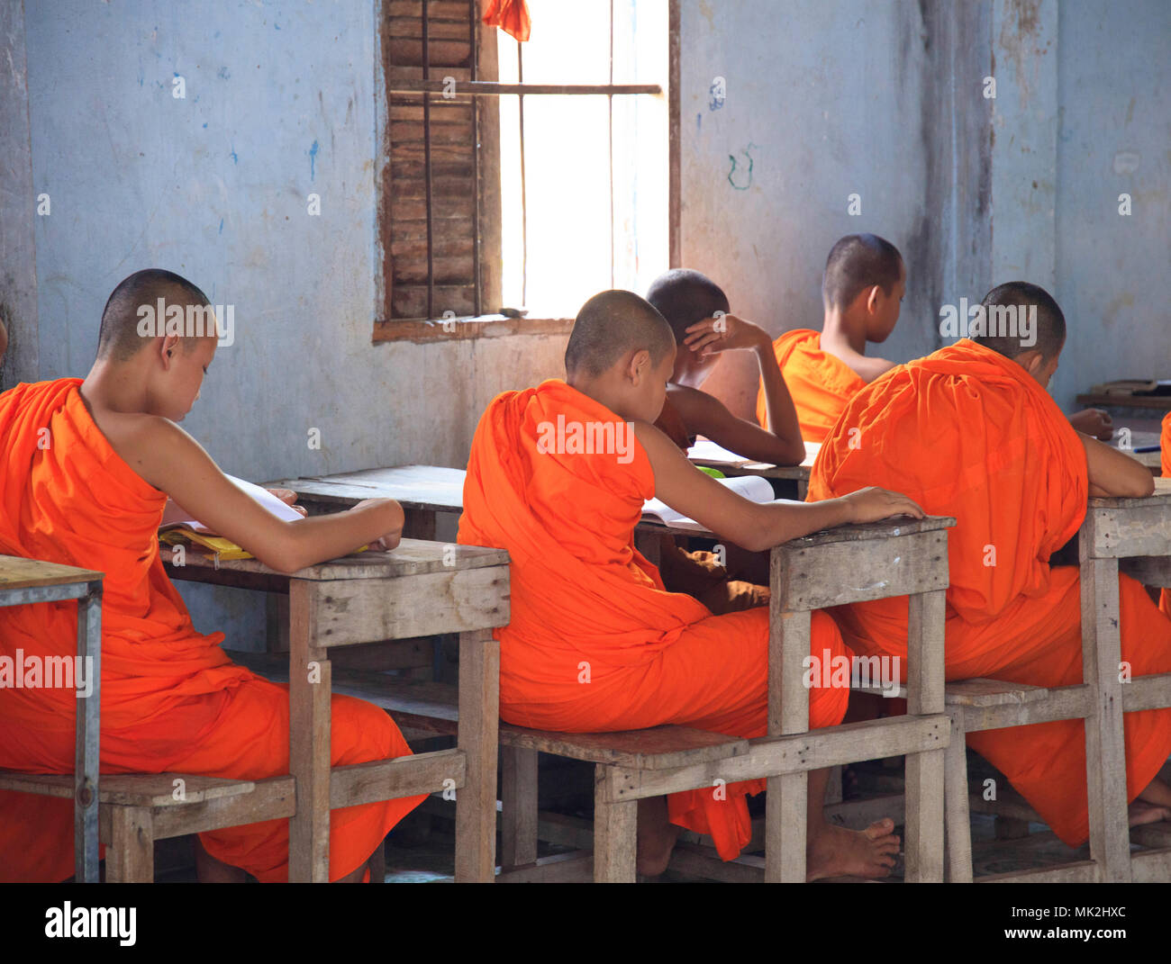 Novice Buddhist monk school children in a classroom in rural Cambodia ...