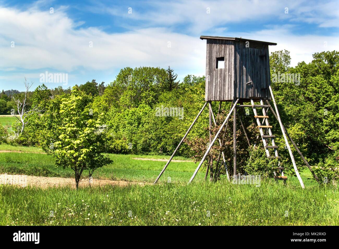 Wooden hunting watchtower in the Czech landscape. Countryside in the ...