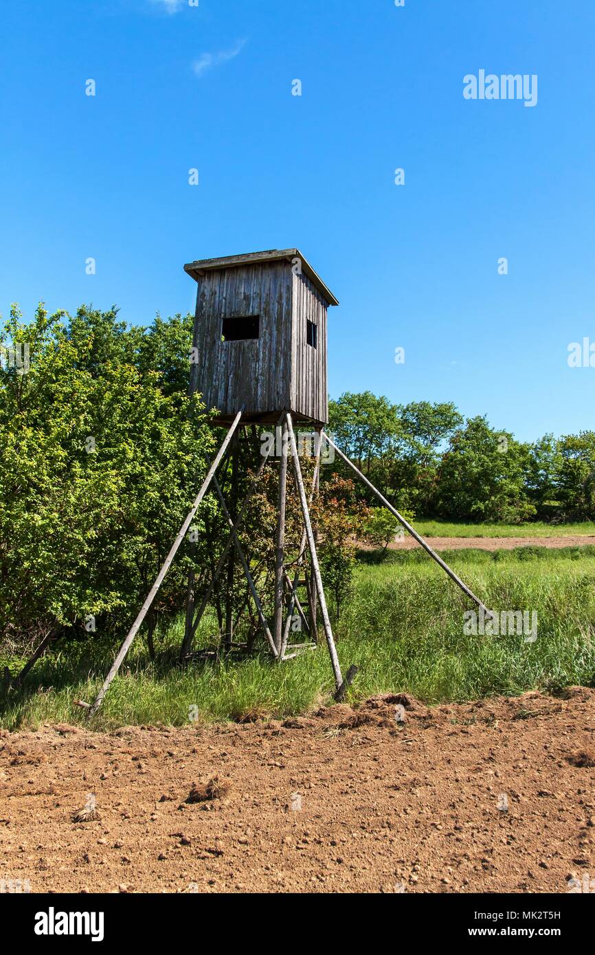 Wooden hunting watchtower in the Czech landscape. Countryside in the ...