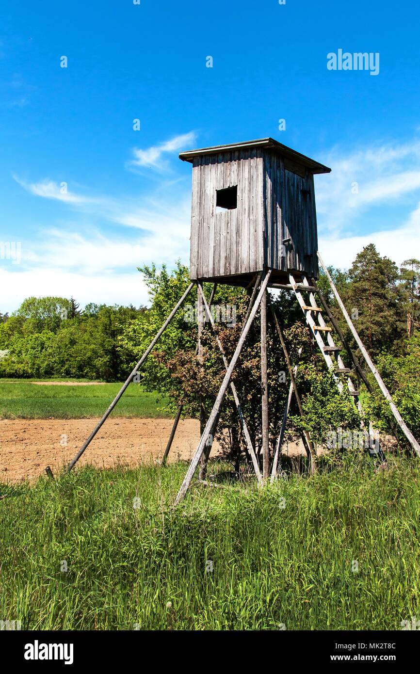 Wooden hunting watchtower in the Czech landscape. Countryside in the ...