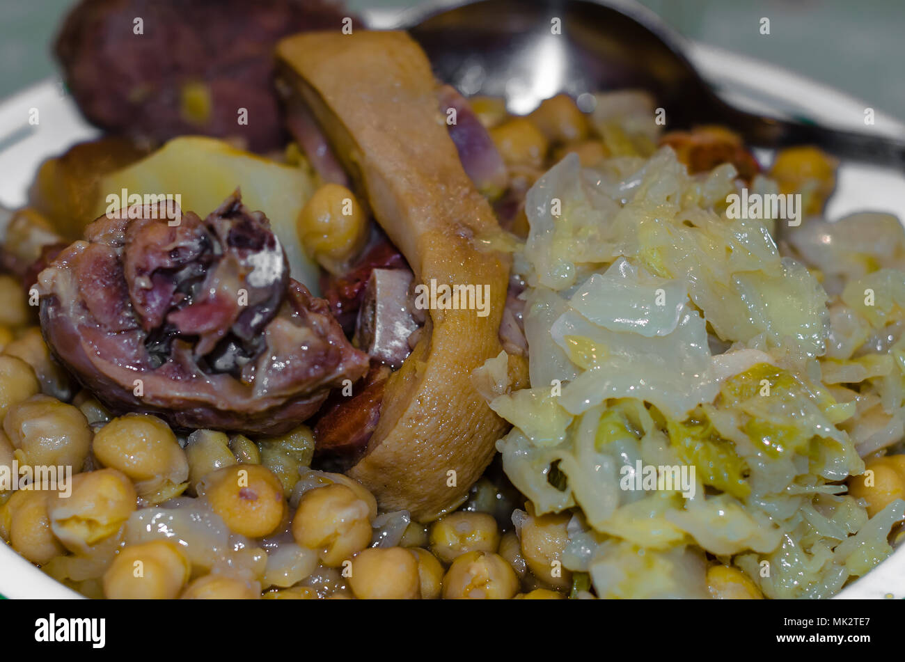A plate of traditional dish from Madrid, Spain called cocido madrileno ...