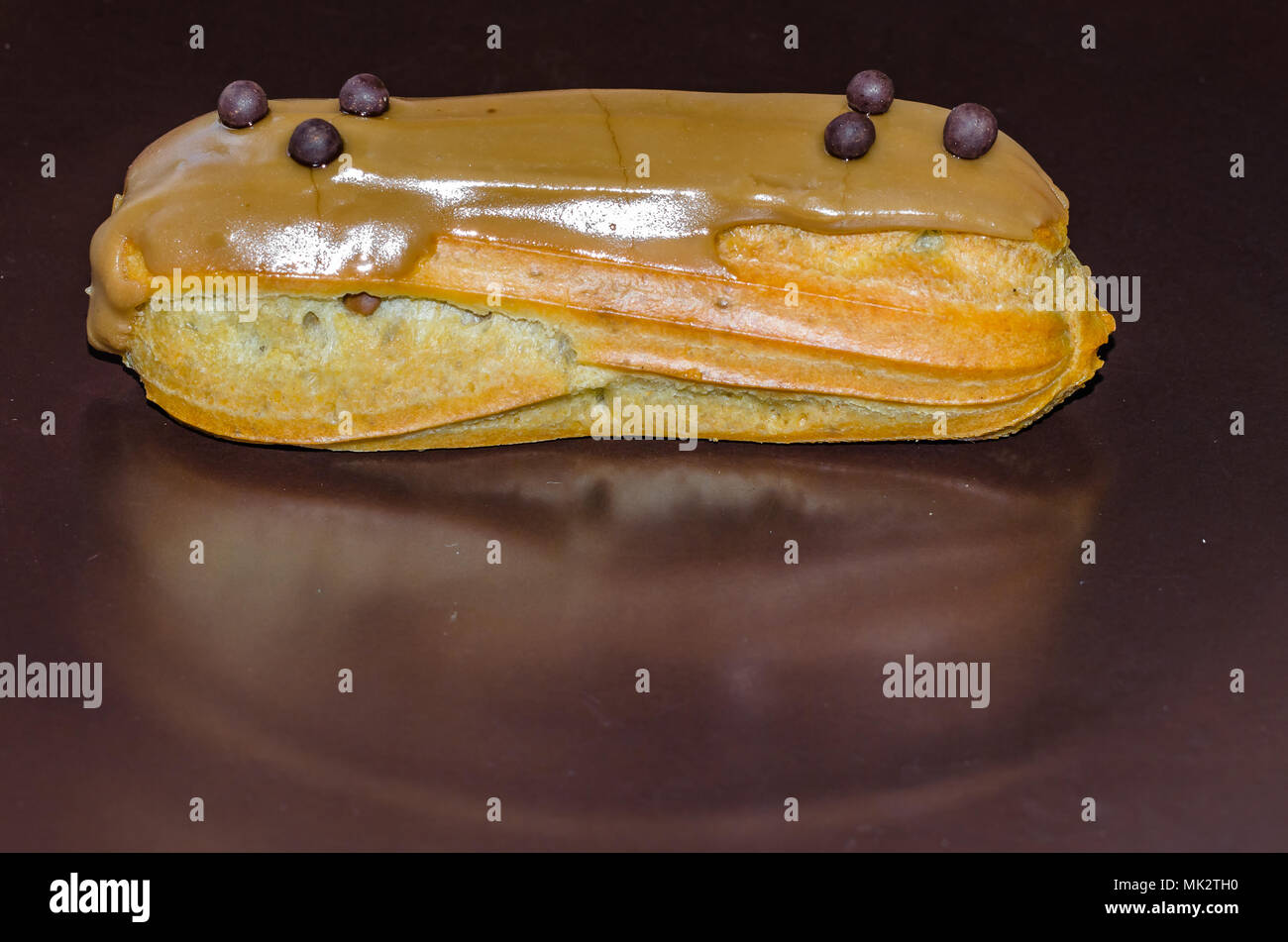 French pastry cuisine, traditional eclair on a plate Stock Photo - Alamy