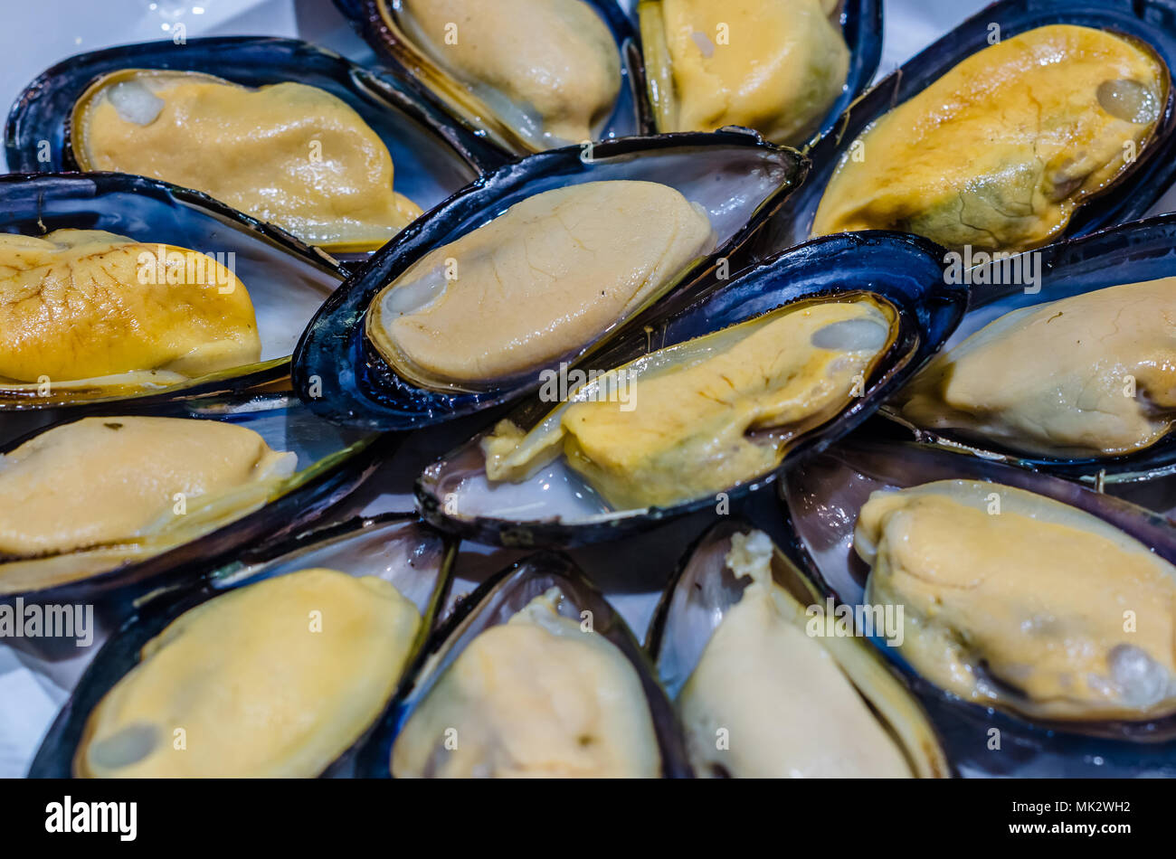 Fresh juicy big mussels dish, seafood background Stock Photo - Alamy