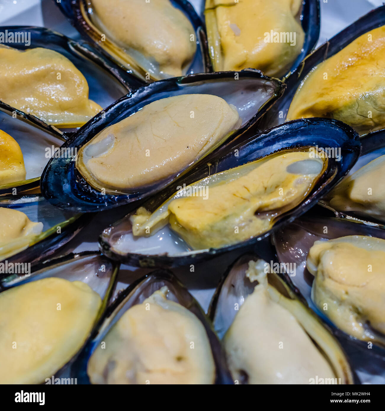 Fresh juicy big mussels dish, seafood background Stock Photo - Alamy