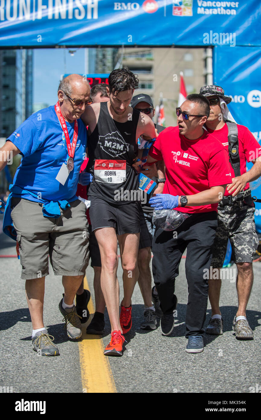 Vancouver, Canada. 6 May 2018. Robin Watson of Canada is aided by ...