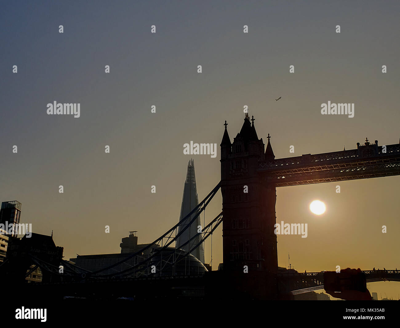 London. UK 6 May 2018 - View of The Shard and Tower Bridge as sun sets ...