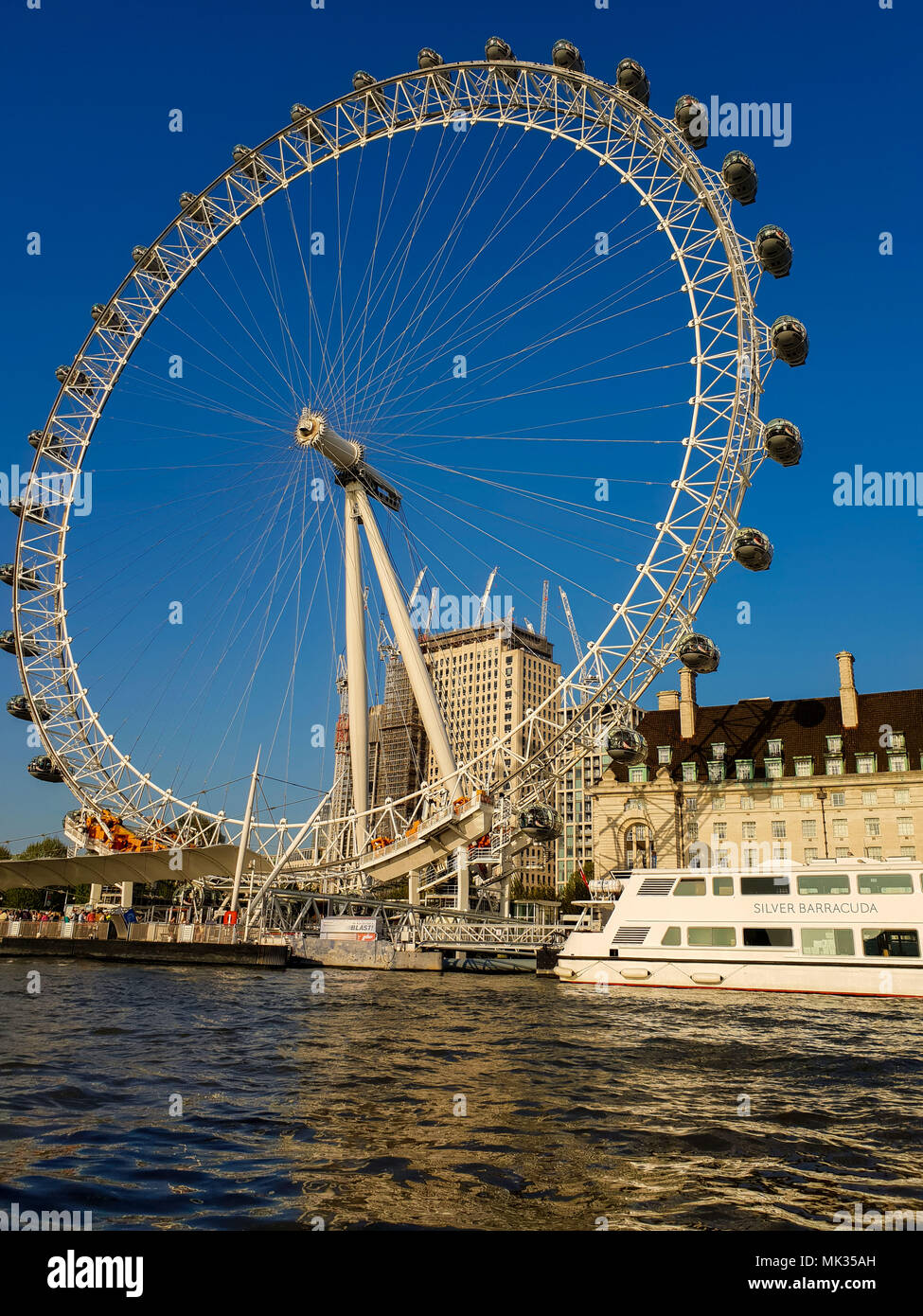 London. UK 6 May 2018 - View of London Eye as sun sets. The view of ...