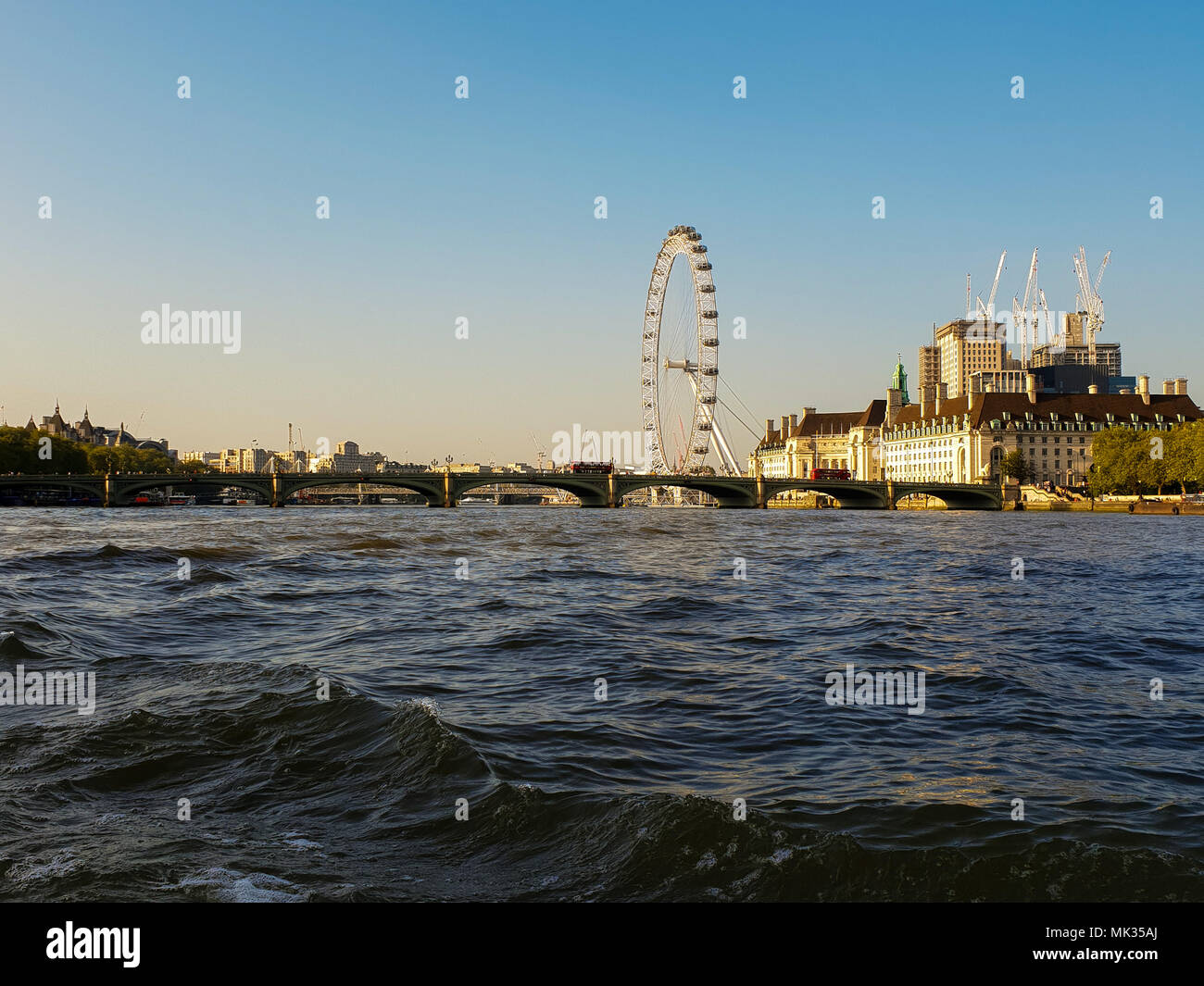 London. UK 6 May 2018 - View of London Eye as sun sets. The view of ...