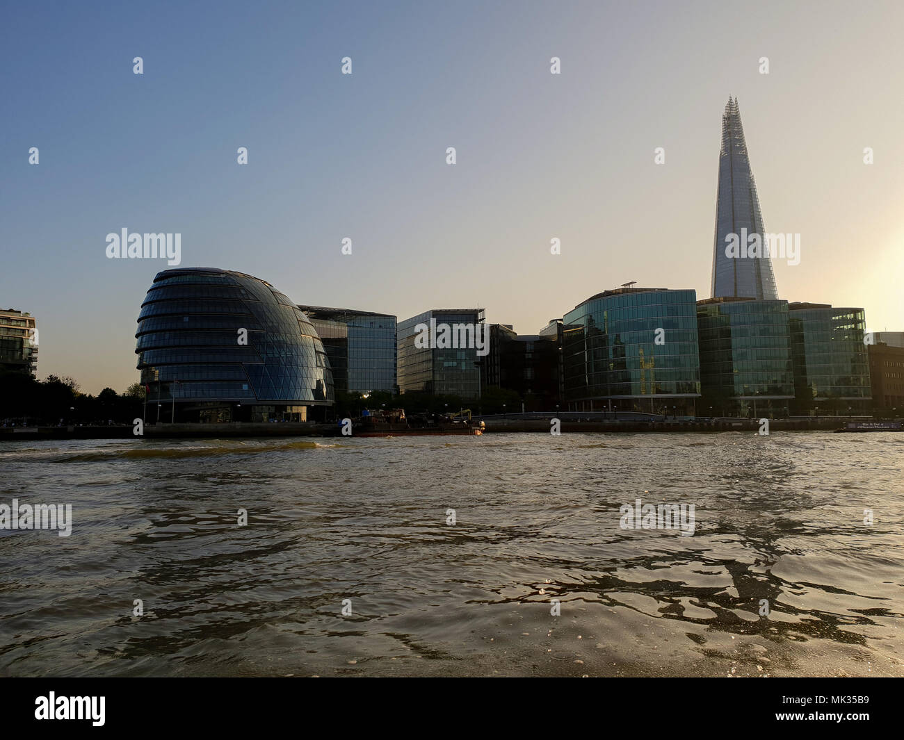 London. UK 6 May 2018 - View of The Shard and City Hall as sun sets ...