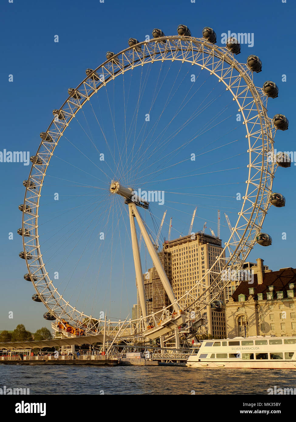 London. UK 6 May 2018 - View of London Eye as sun sets. The view of ...