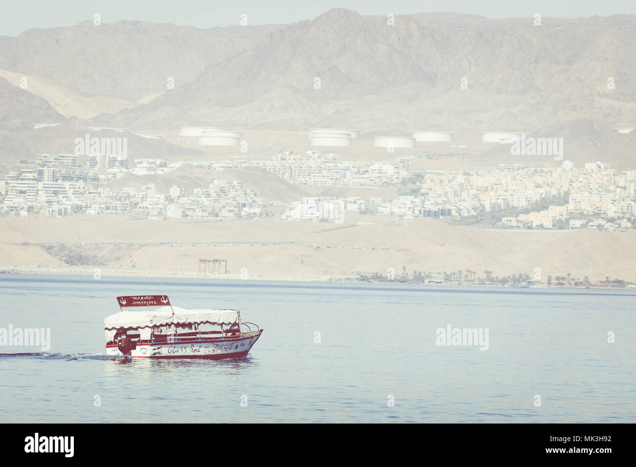 Touristic ships on the beach of Aqaba, Jordan. Popular resort, located ...