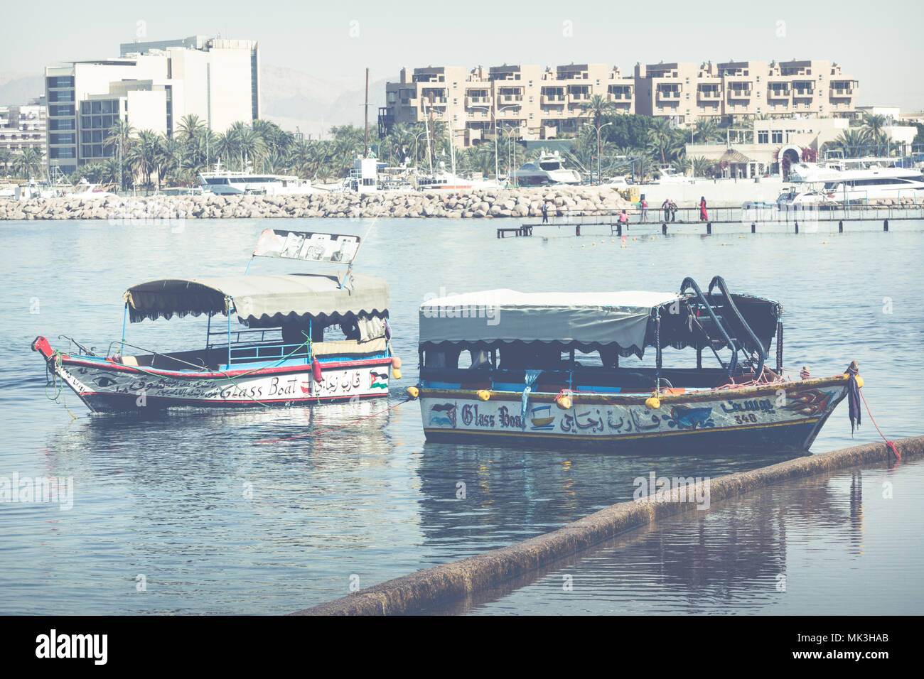 Touristic ships on the beach of Aqaba, Jordan. Popular resort, located ...