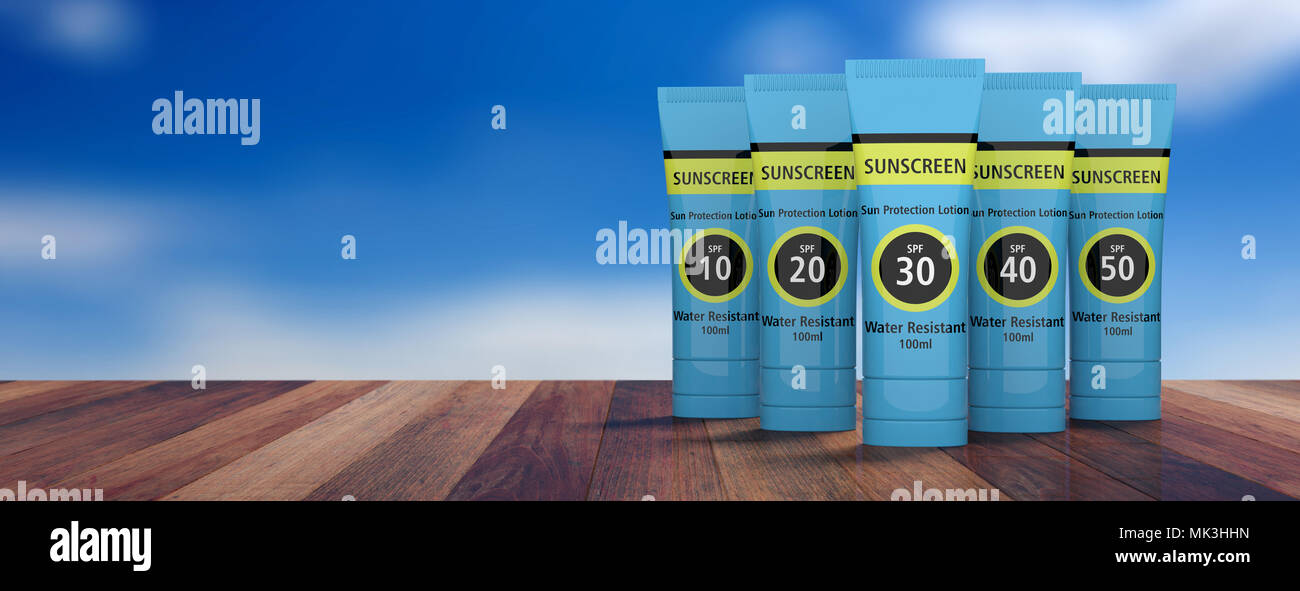 Sun tan protection. Sunscreen lotion tubes, various spf, on wooden deck ...