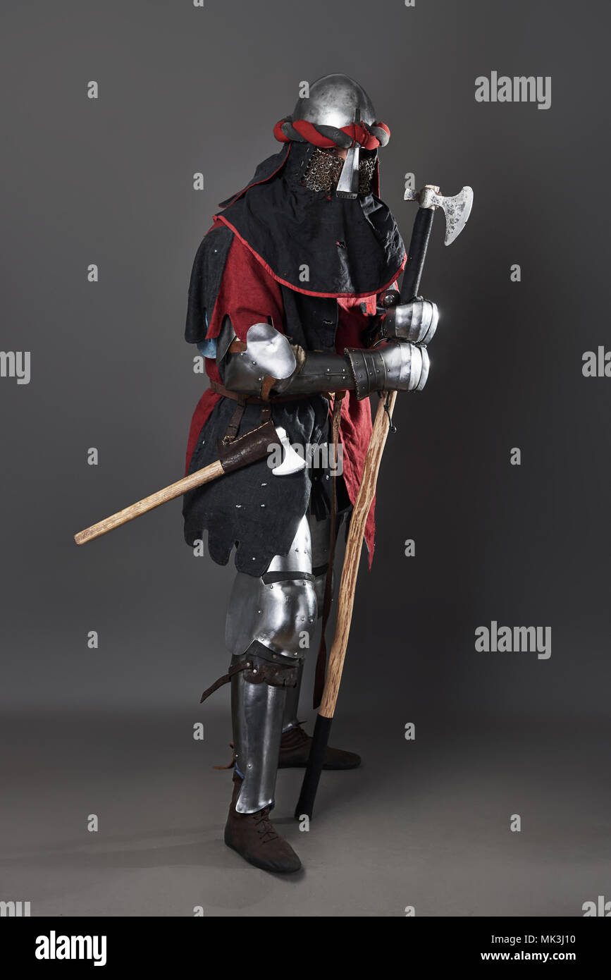 Medieval knight on grey background. Portrait of brutal dirty face ...