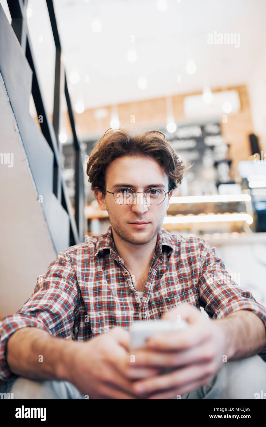 Man drinking a cup of coffee in the cafe Stock Photo - Alamy