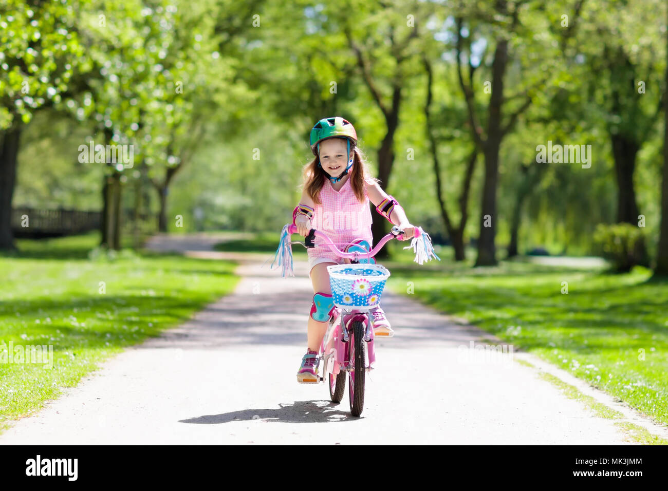 Two children learning bike ride hi-res stock photography and images - Alamy