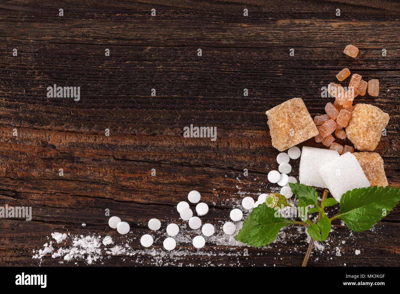 Various types of sugar with aztec sweet herb leaves from above on ...