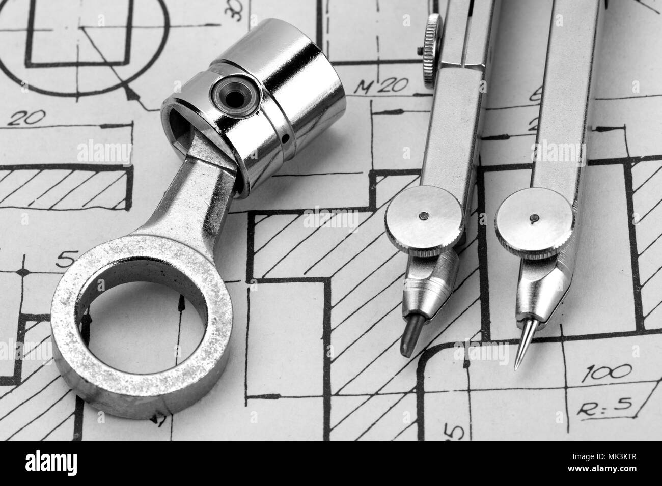 piston on engineering design paper with technical draws and compas ...