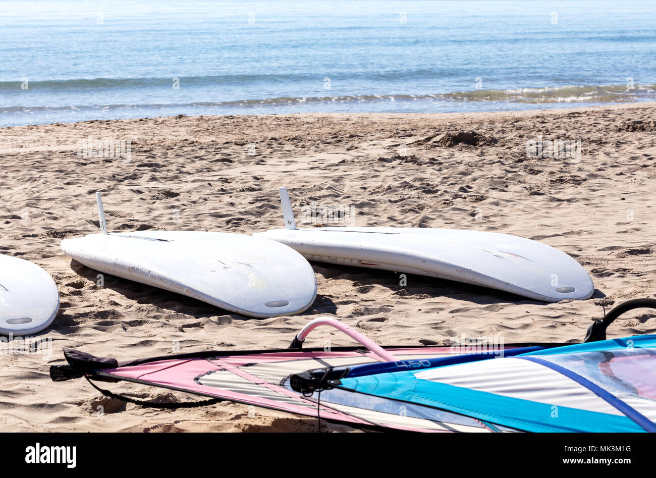 windsurf tables on the sand in a mediterranean beach Stock Photo - Alamy
