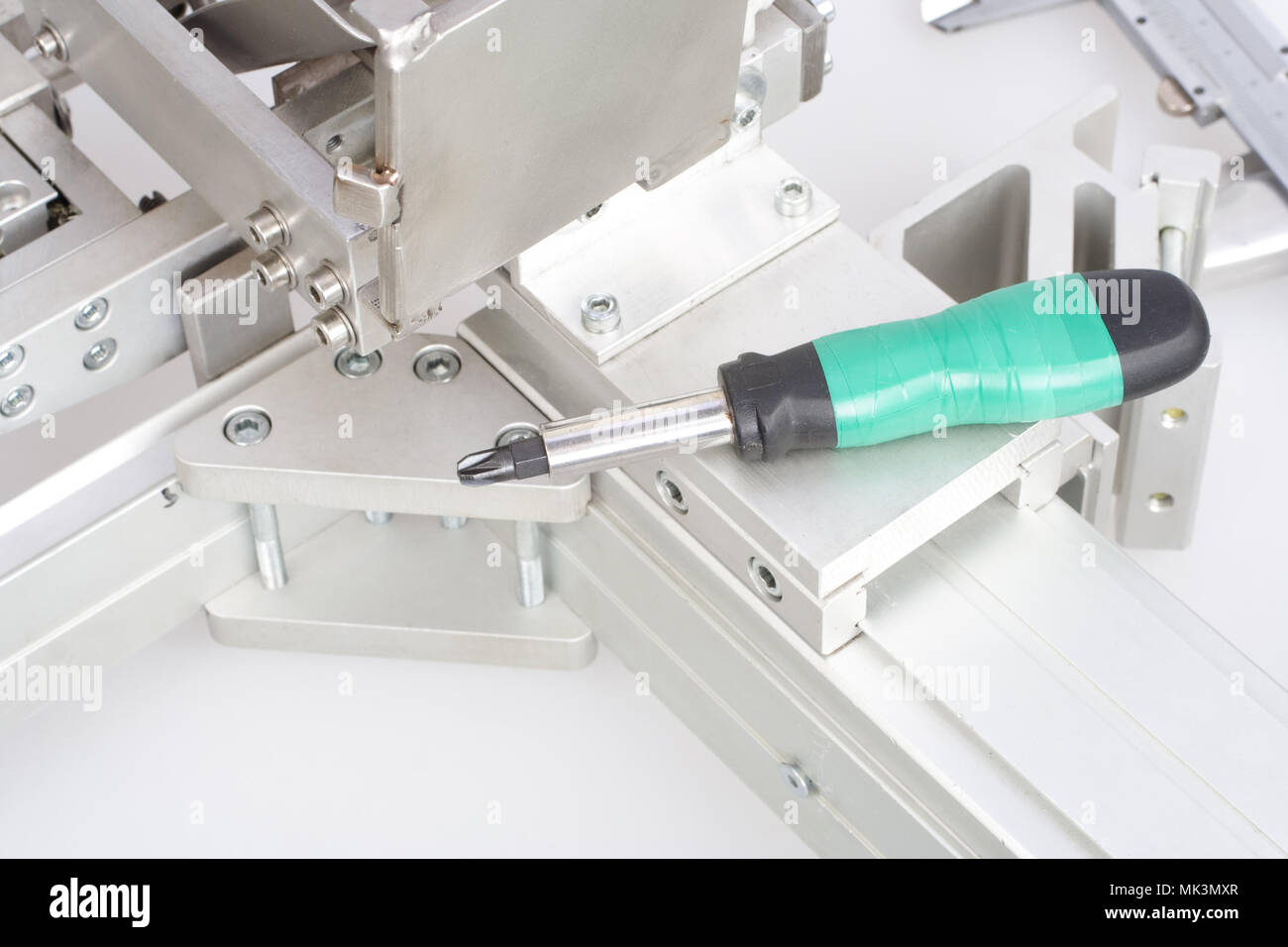 screwdriver, screw, nuts - repair of industrial equipment Stock Photo ...