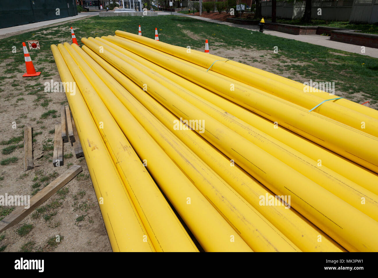 Yellow utility pipes Stock Photo - Alamy