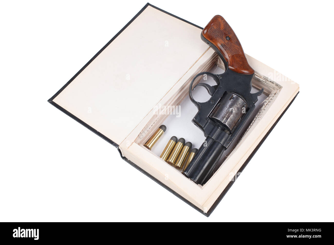 Revolver gun with cartridges hidden in a book isolated on white ...