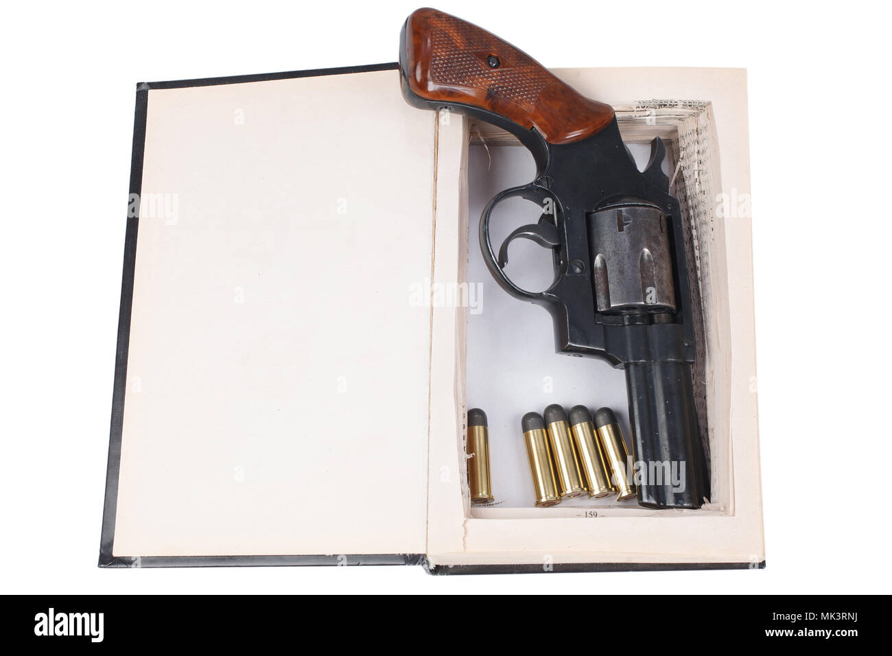 Revolver gun with cartridges hidden in a book isolated on white ...
