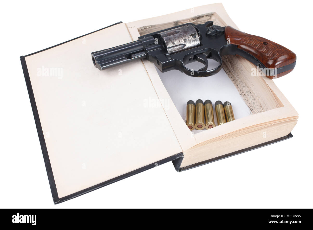 Revolver gun with cartridges hidden in a book isolated on white ...