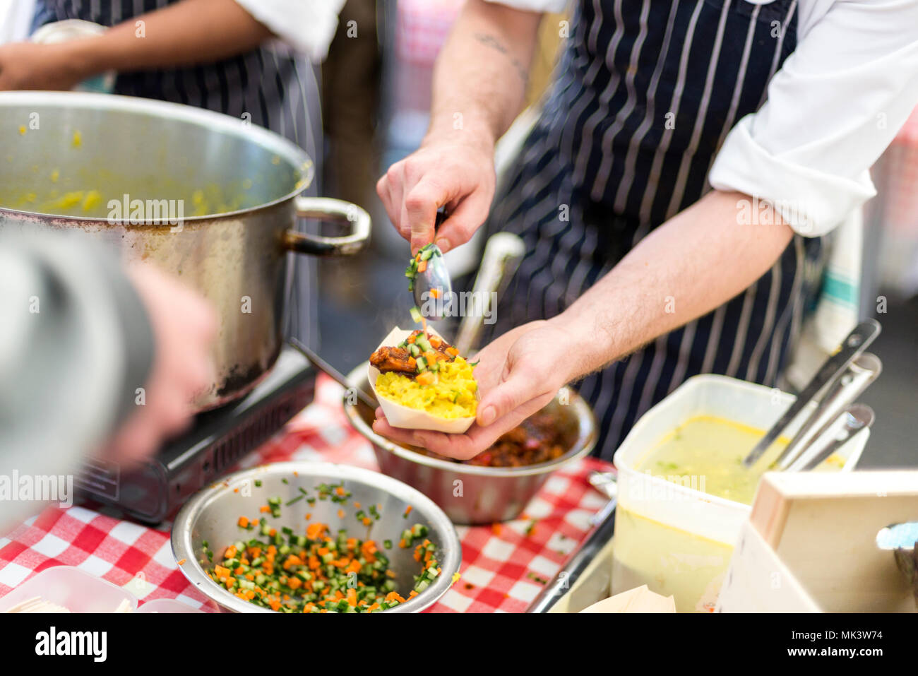 Serving up the hungry visitors at the Food Festival Stock Photo - Alamy