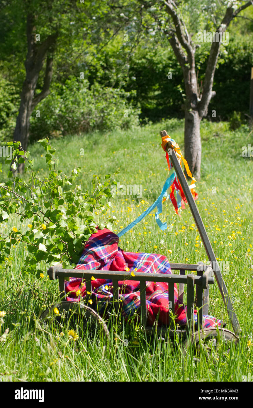 A handcart with a blanket nad colorful ribbons on a wonderful spring ...