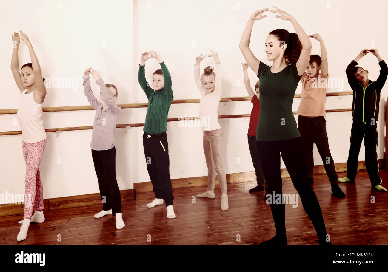 Group of happy american children practicing at the ballet barre Stock ...