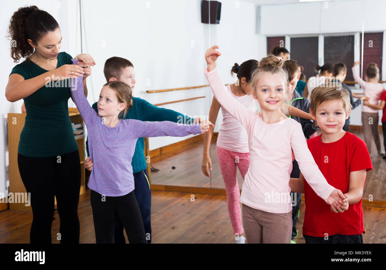 Group of kids dancing pair dance in dance class Stock Photo - Alamy