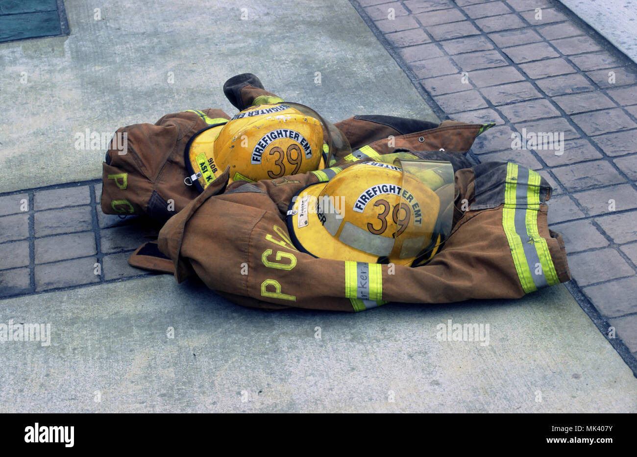 firefighters gear sitting in a pile on the floor waiting for use Stock ...