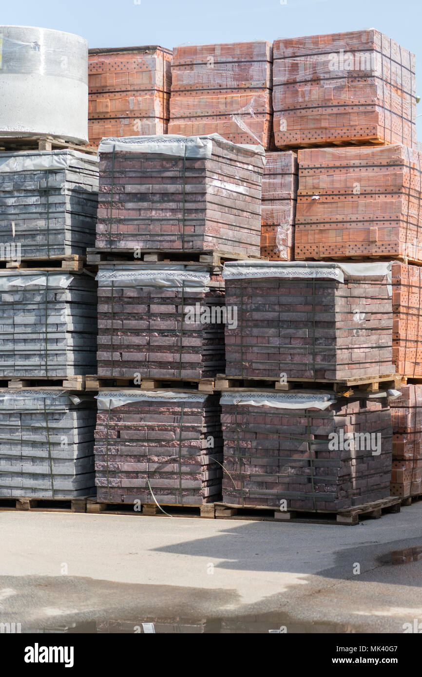 new bricks on pallets. pallets with bricks in the building store. Racks ...