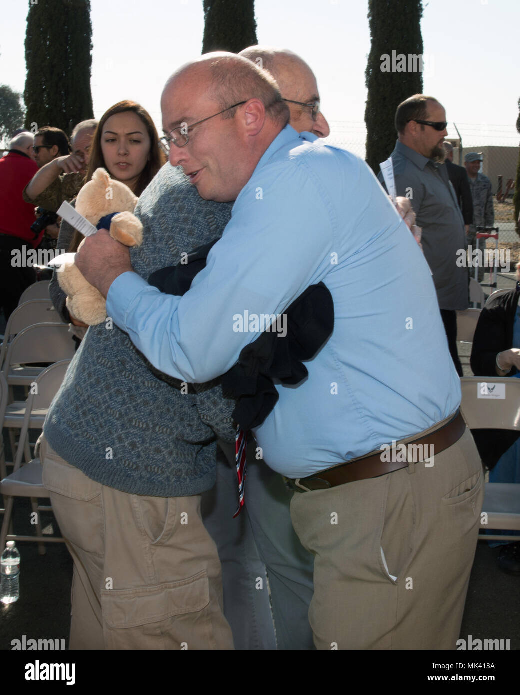 Michael Wieger Jr., the brother OSI agent David Wieger receives a hug ...