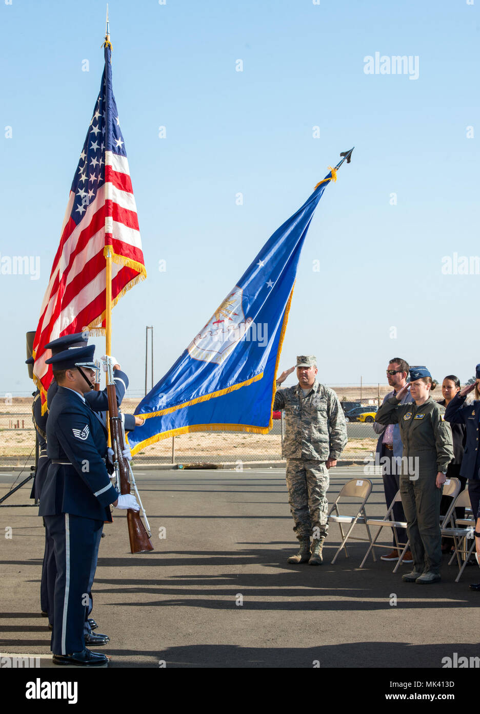 The honor guard present the Colors during a ceremony honoring OSI agent ...