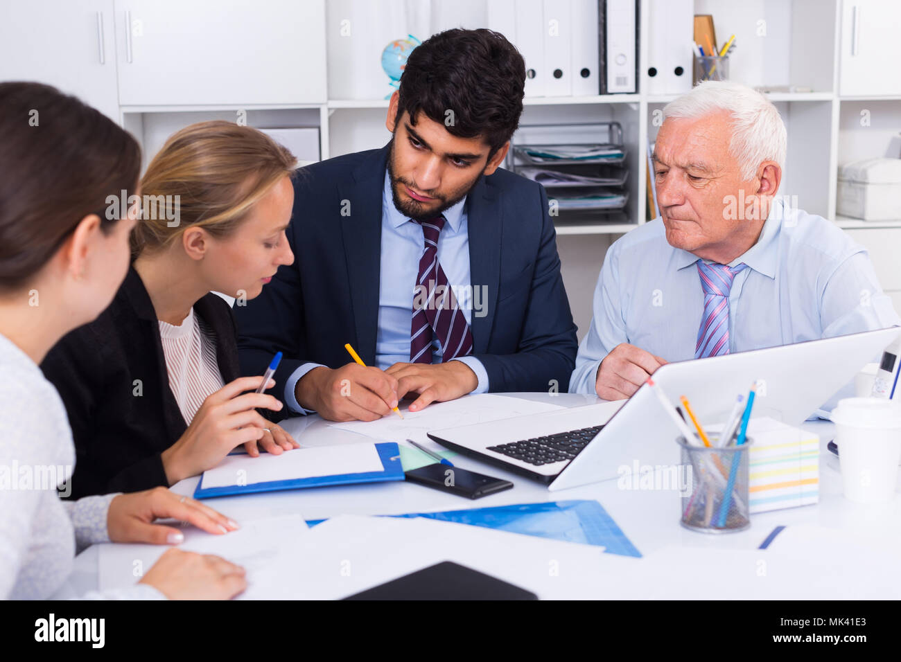 Office workers are writing financial reports in the office Stock Photo ...