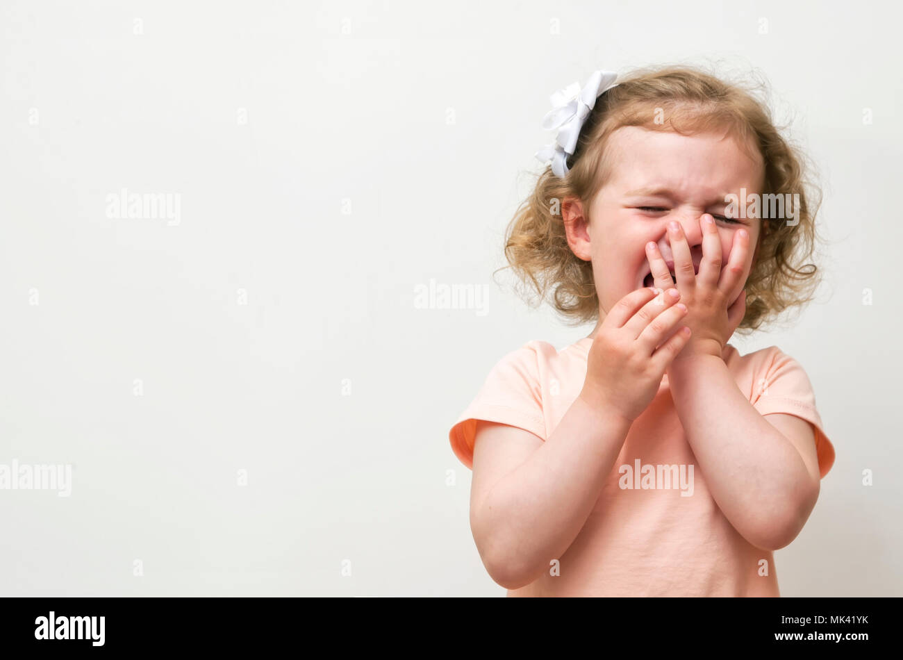 Baby Girl crying over white background Stock Photo - Alamy