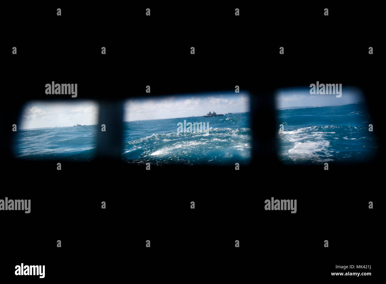 Amphibious Assault Vehicles can be seen in the distance through the ...