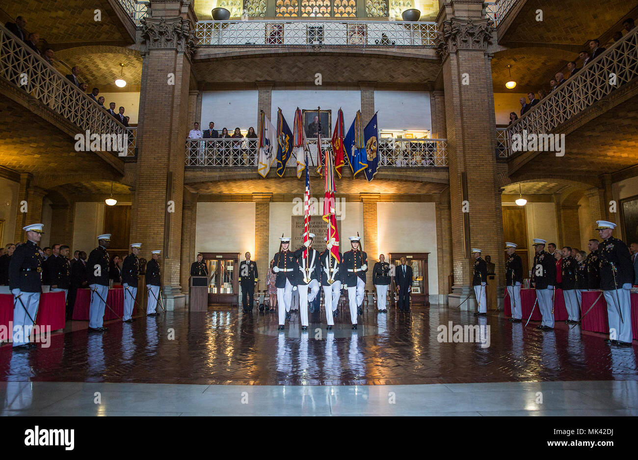 The U.S. Marine Corps Color Guard marches in the rotunda of Roosevelt ...