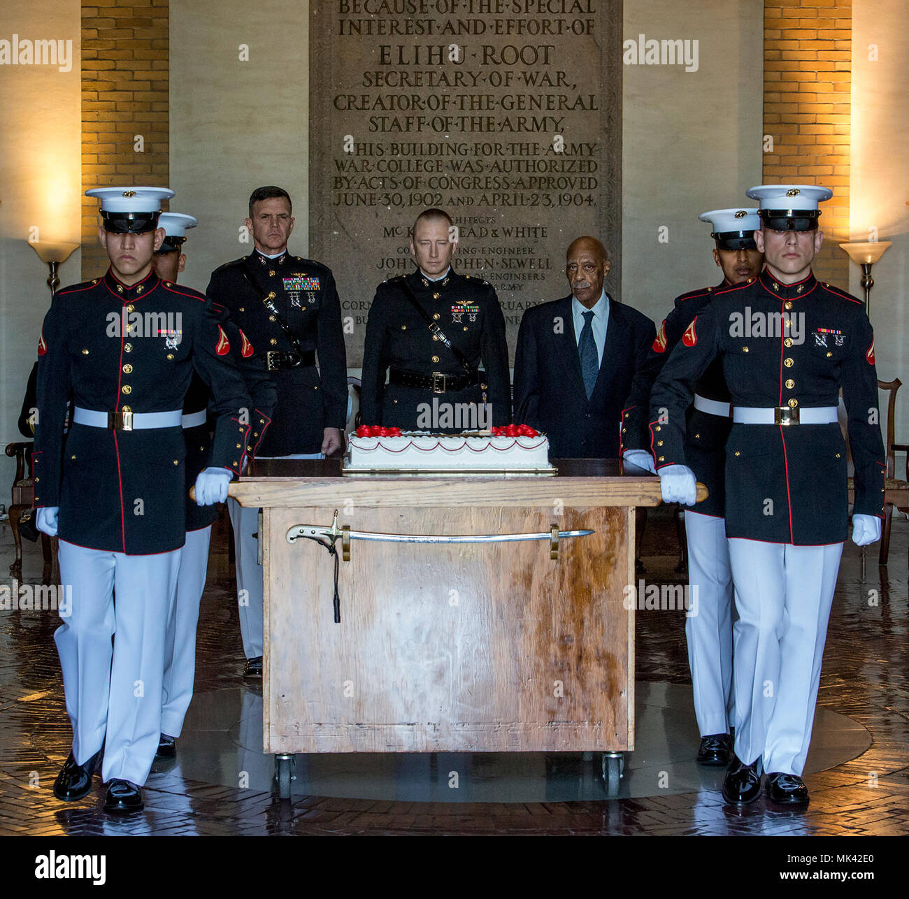 A cake cutting detail with Marine Barracks Washington D.C. marches ...