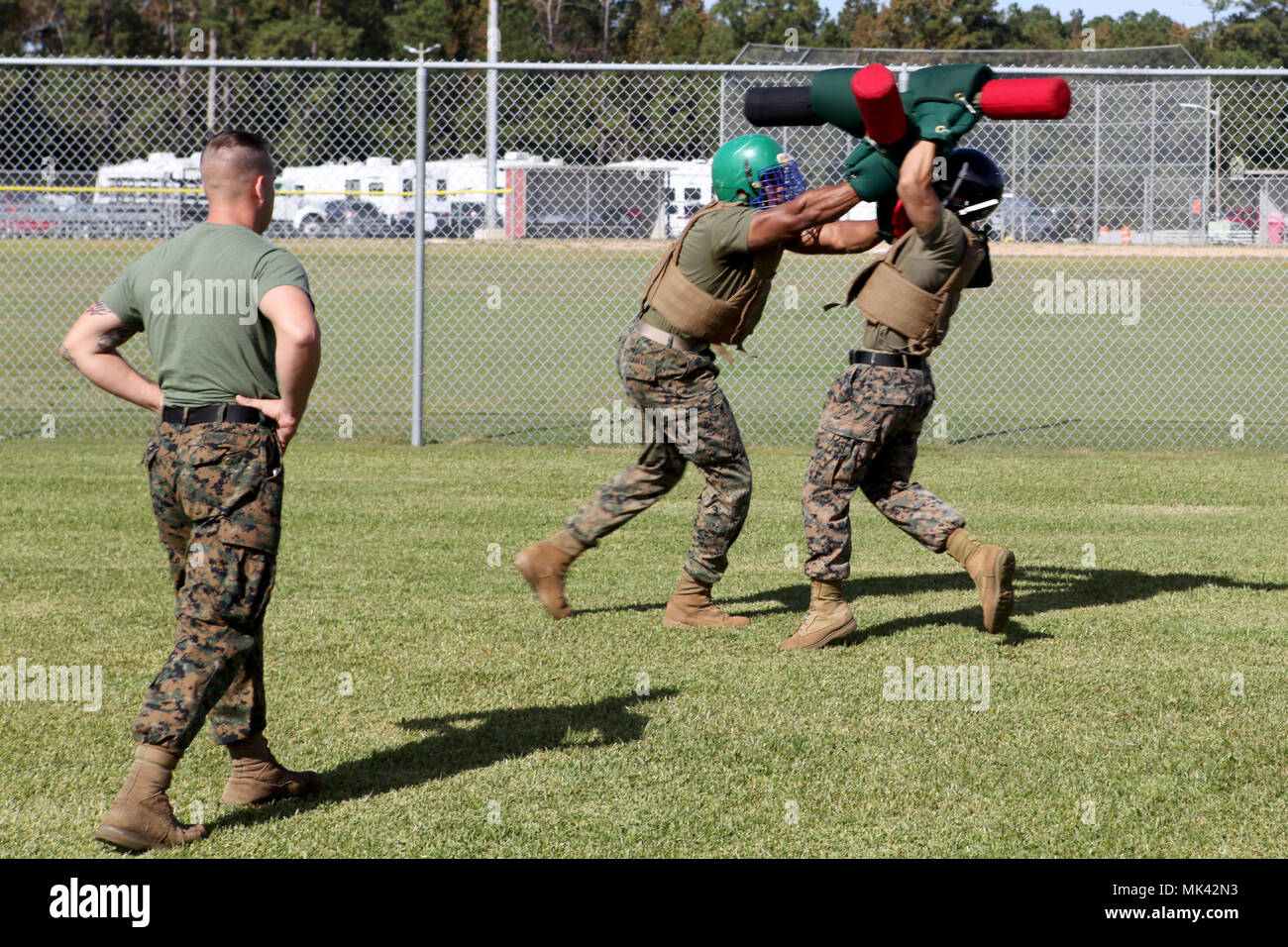 Marines battle it out in a pugil stick bout during a semi-annual field meet between Headquarters ...