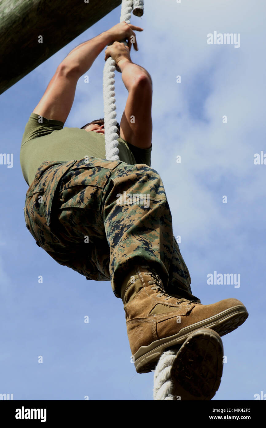 Cpl. Randy Garcia completes a rope climb during a semi-annual field ...