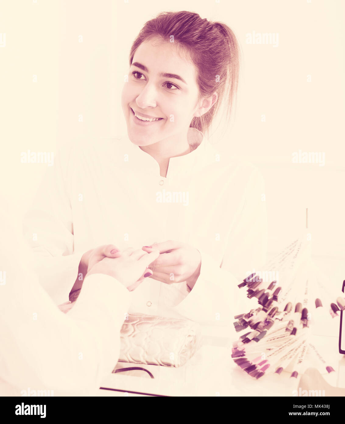 Female client doing nails in nail salon in afternoon Stock Photo - Alamy