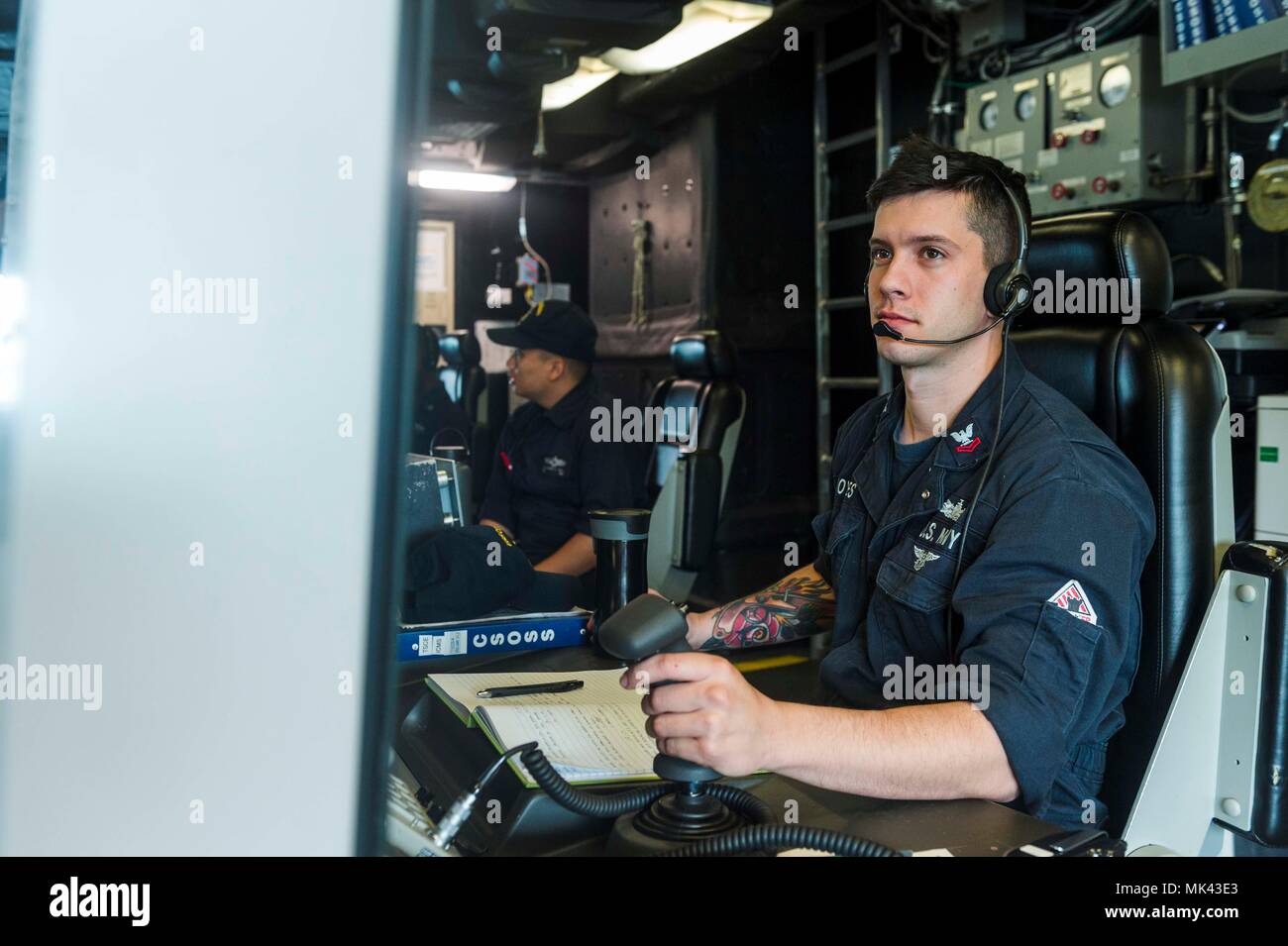Fire Controlman 1st Class Jacob Boyles stands watch during a sea-and ...