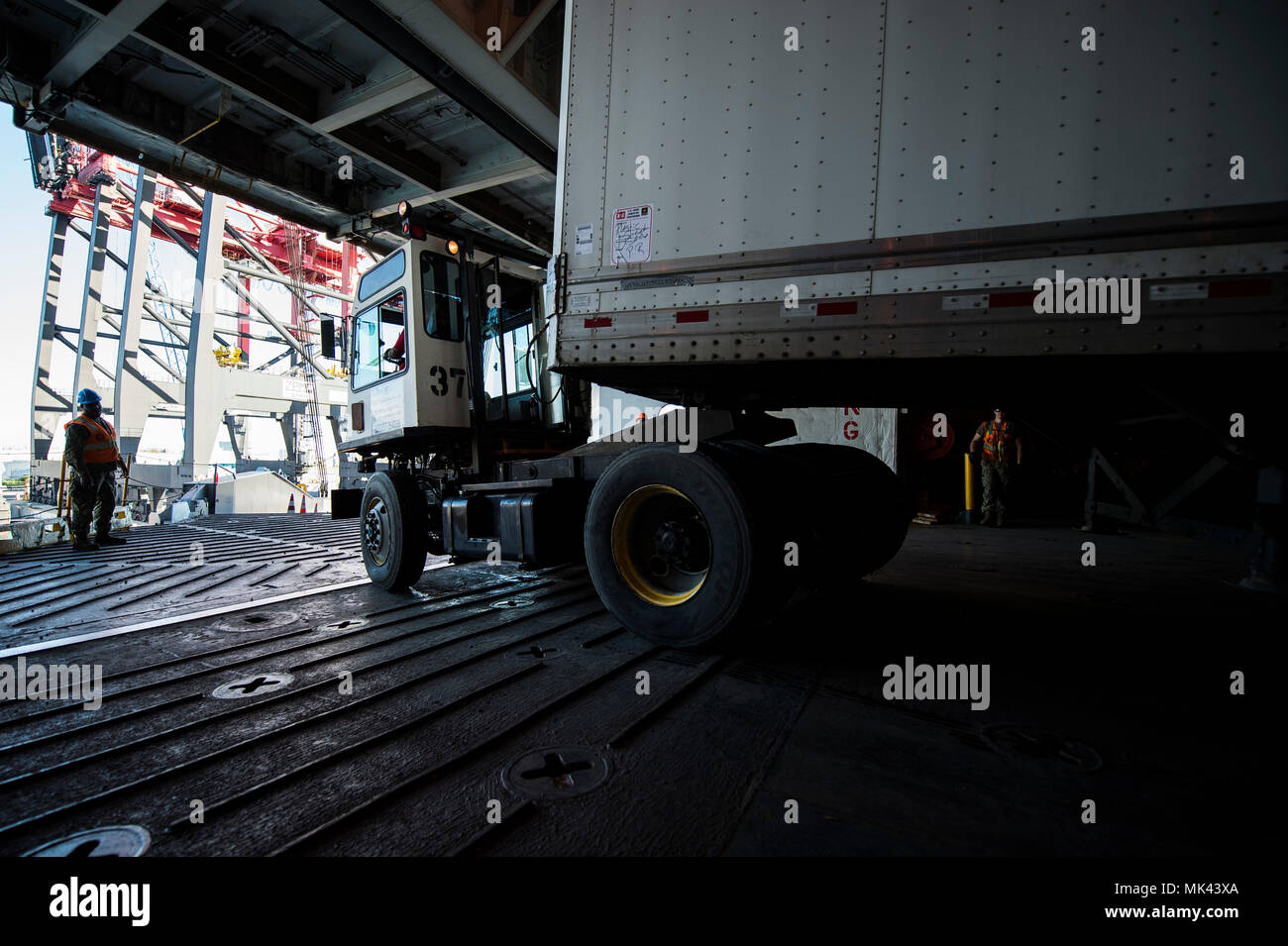 A semi-truck drives off the USNS Brittin, in Ponce, Puerto Rico, Nov. 3 ...