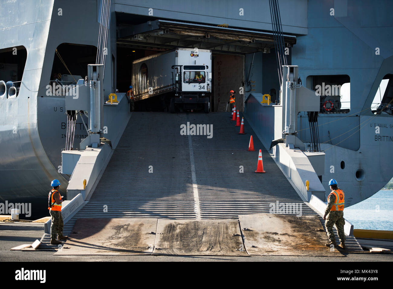 A semi-truck drives off the USNS Brittin, in Ponce, Puerto Rico, Nov. 3 ...